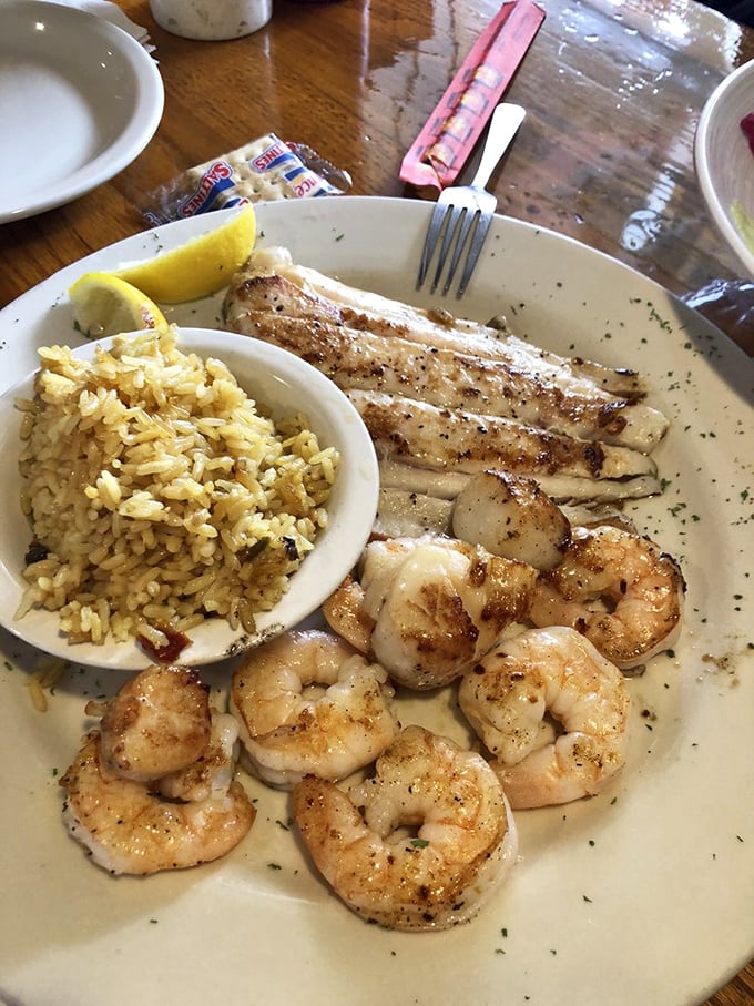Perfectly grilled shrimp and fish nestled beside seasoned rice – the kind of plate that makes you wonder why you ever eat anything else.