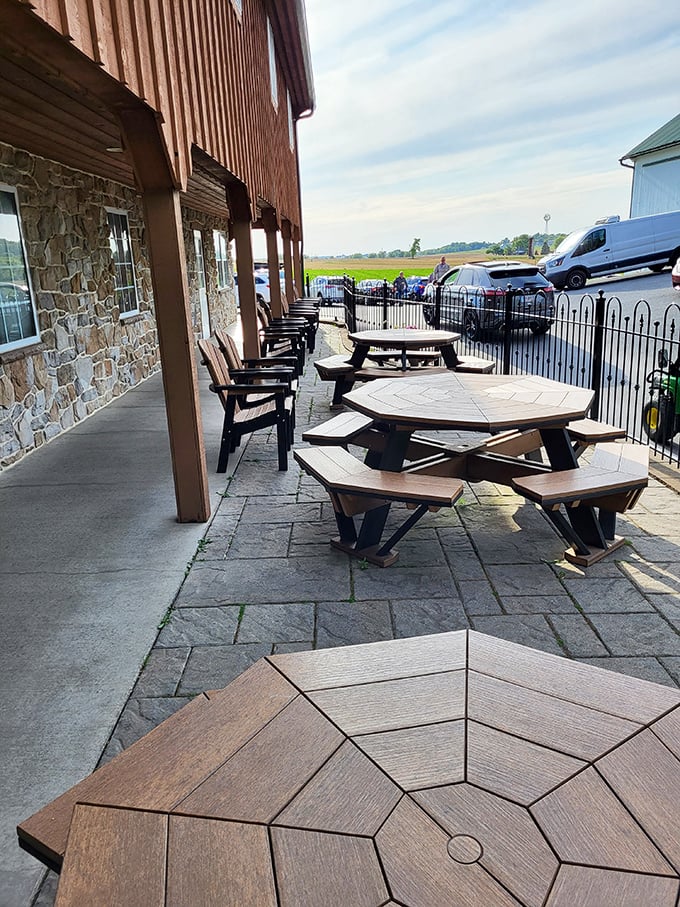 Outdoor seating with a view of Pennsylvania farmland—where every wooden bench has hosted countless ice cream epiphanies.