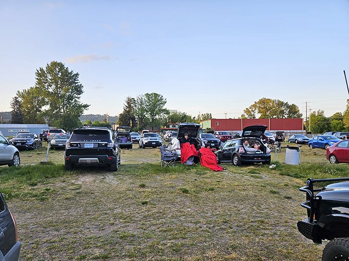 Blankets, camp chairs, and the great outdoors—some moviegoers create living rooms between cars, proving community happens in the spaces between.