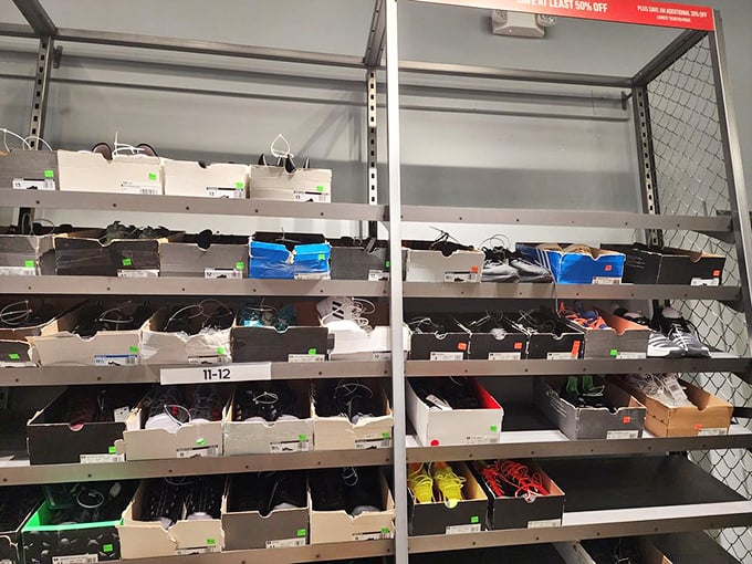 The shoe section at the Nike Factory Store—a wall of possibilities where last season's models cost less than a tank of gas.