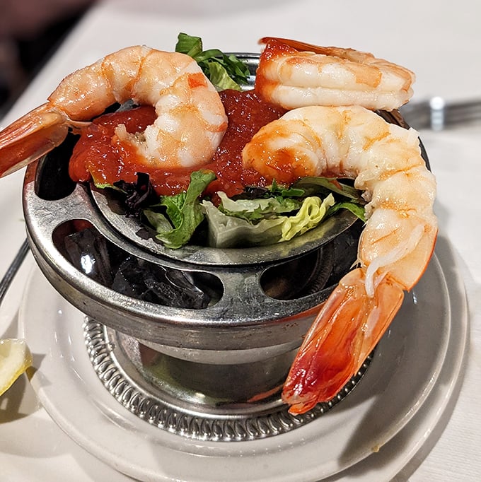 Jumbo shrimp cocktail – ocean treasures perched on the edge of their serving dish like they're about to dive into that zesty sauce.