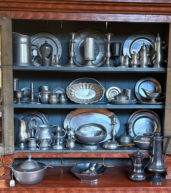 Pewter and silver treasures gleam with history. These aren't just serving pieces—they're conversation pieces waiting to grace your table.
