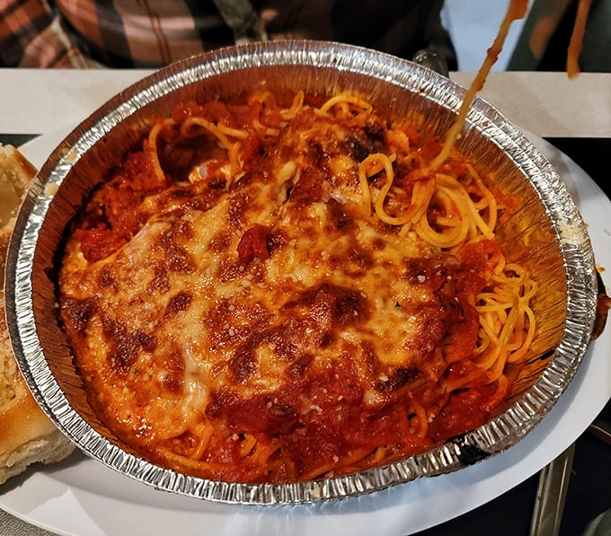 Spaghetti under a blanket of melted cheese – because sometimes more really is more, folks.