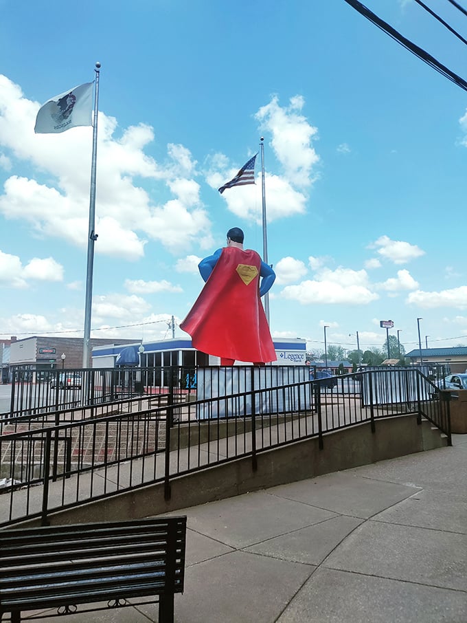 Superman's cape catches the breeze while the Illinois flag stands at attention—a perfect small-town tableau.