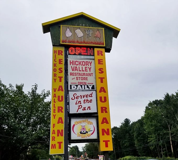 The roadside sign promises "Served in the Pan"—a declaration of authenticity that's been drawing hungry travelers for generations.