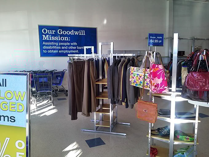 Goodwill's mission statement proudly displayed alongside professional attire—shopping that helps others climb the career ladder too.