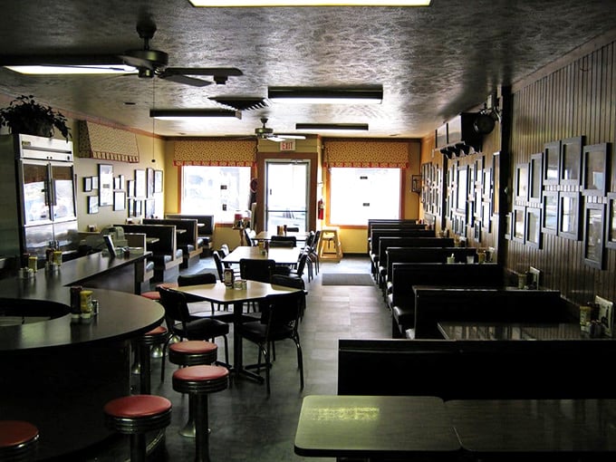 The dining room at Nick's—where strangers become friends and diet plans go to die. These tables have hosted more heartfelt conversations than most therapists' offices.