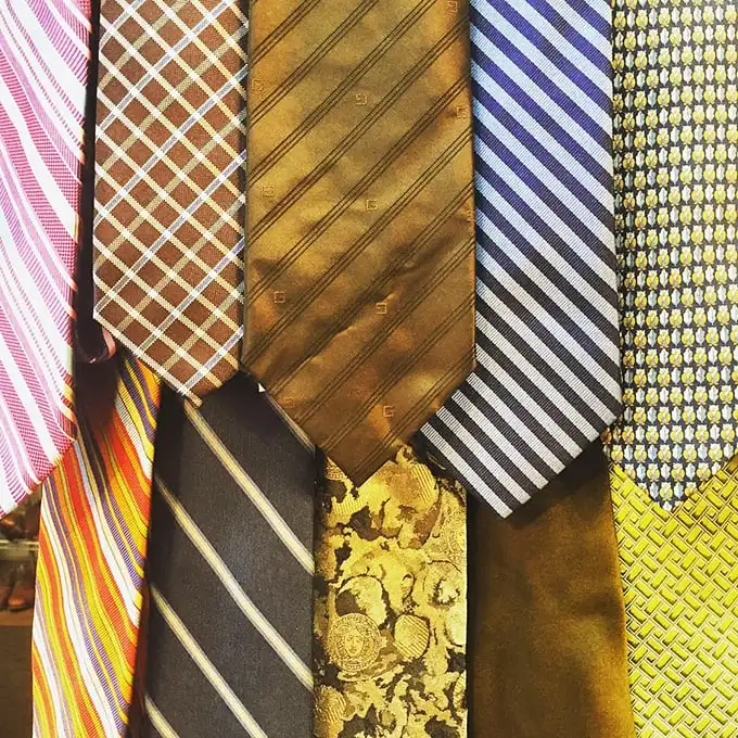 Neckties that tell tales of boardroom battles and champagne celebrations, now awaiting their next power lunch or wedding toast.