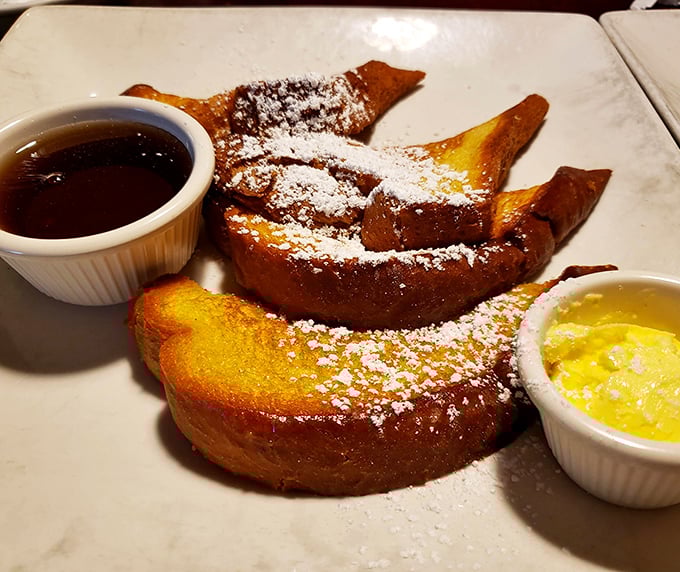 French toast that makes ordinary breakfast feel like amateur hour. That powdered sugar dusting isn't just garnish—it's the final touch of morning perfection.