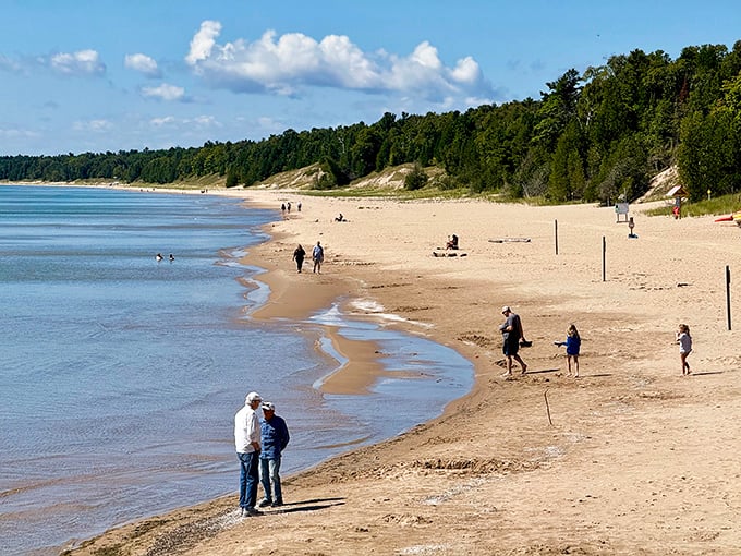 Social distancing, nature's way. Visitors enjoy the simple pleasure of sand between toes while Lake Michigan provides the perfect backdrop.