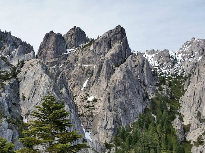 Winter transforms Castle Crags into a snow-dusted wonderland. The granite spires wear their white caps like distinguished gentlemen at a formal geological gala.