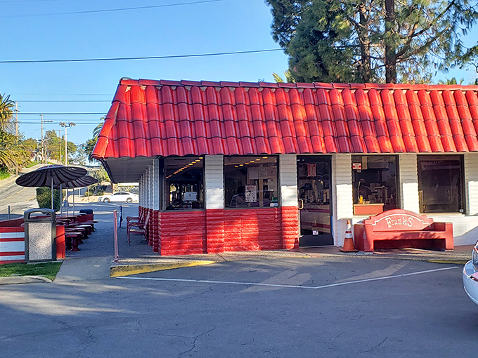 The carnival-bright stripes aren't just for show – they signal serious hot dog fun awaits inside this cheerful spot.