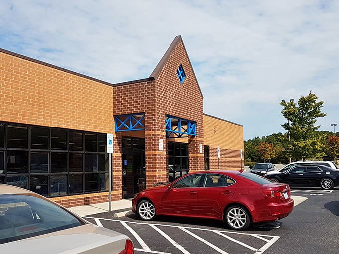 The distinctive peaked entrance of this Goodwill store in Lowell adds architectural interest to an otherwise simple brick building. That blue trim is a nice touch!