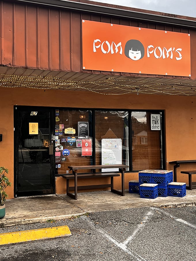 Pom Pom's orange storefront and twinkling lights invite you into a world where sandwiches dare to be different.