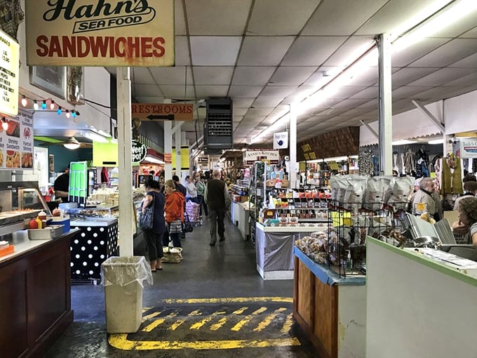 Inside Roots Market, the aroma of fresh seafood mingles with the buzz of conversation as shoppers navigate the indoor maze.