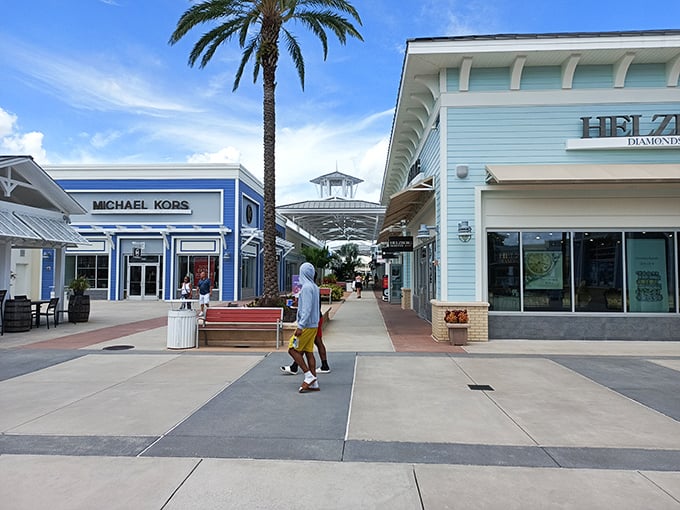 Palm trees frame this shopping oasis like nature's own welcome mat for bargain hunters.