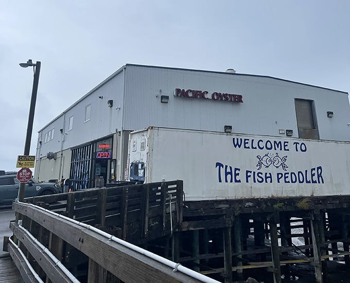 "WELCOME TO THE FISH PEDDLER" isn't just a sign—it's an invitation to seafood paradise. Those stilts mean you're practically dining on the water.