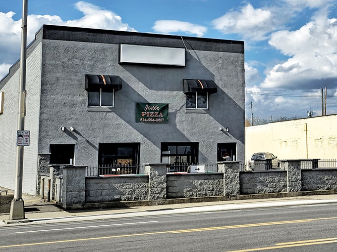 Josie's sign hangs like a beacon for Franklinton pizza pilgrims. This corner spot has witnessed decades of "first bite" smiles.