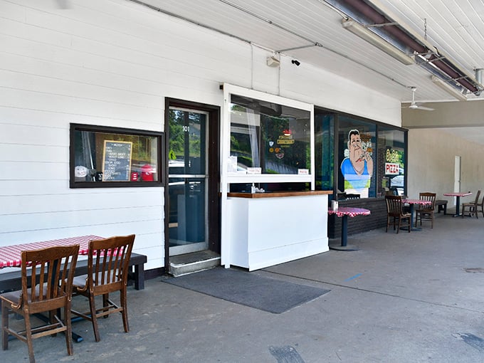 Simple white walls and wooden tables keep the focus where it belongs—on Big Ed's legendary pies. No distractions, just pizza perfection.