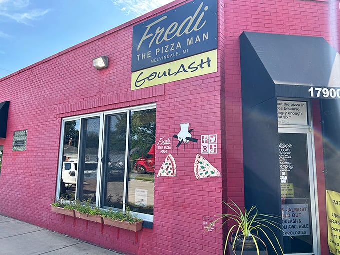 The welcoming storefront promises the kind of neighborhood pizza experience that turns strangers into regular customers.