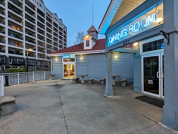 The blue "DINING ROOM" sign understates what awaits – a riverside seafood experience worth crossing state lines for.