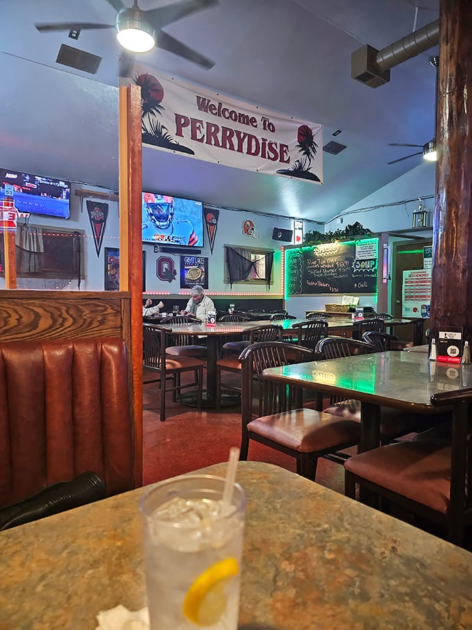 The "Welcome to Perrydise" banner sets the tone for lakeside dining where every meal feels like vacation.