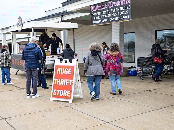 The sidewalk scene at Ultimate Treasures proves that serious thrifters will brave any weather for the chance at secondhand gold.