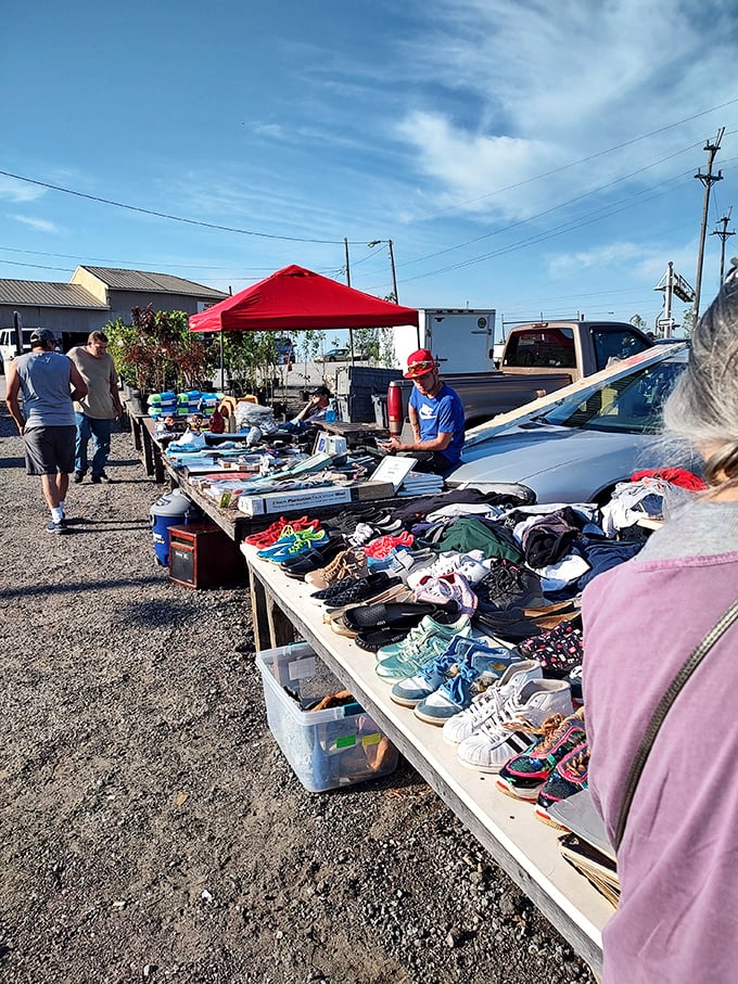 Shoes, clothes, and unexpected treasures line outdoor tables at White Horse Flea Market. The thrill of the hunt is real!