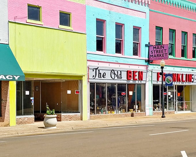 Neon storefronts in Yazoo City pop like candy colors against the sky - sweet deals included.