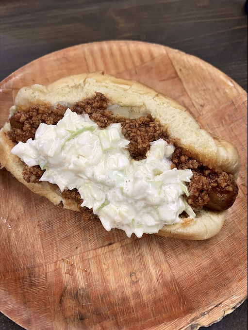 Behold the legendary West Virginia Dog in all its glory – meat sauce, coleslaw, and mustard creating a harmony that Mozart would envy.