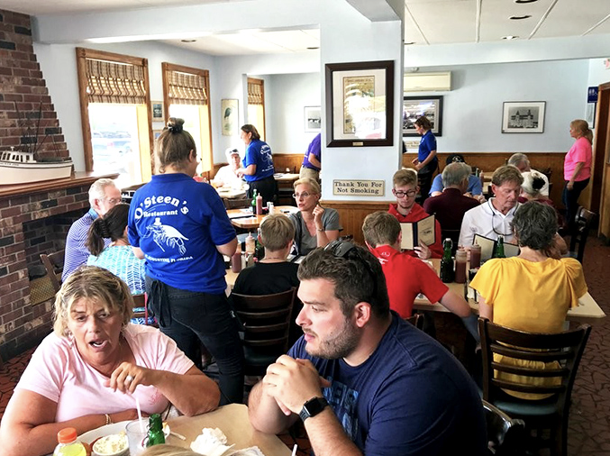 Blue-shirted servers moving with practiced efficiency—the unsung heroes who've memorized more orders than most of us can remember phone numbers.