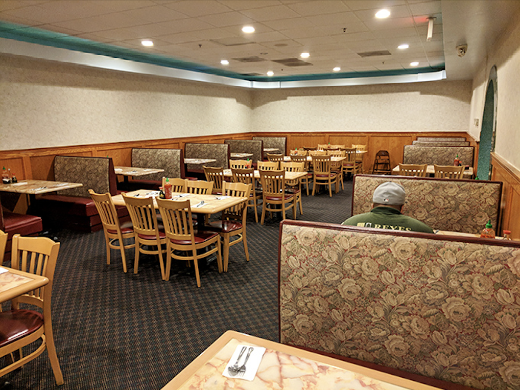 Cozy booths and simple wooden chairs create an unpretentious dining room where the focus stays squarely where it belongs—on your heaping plate.