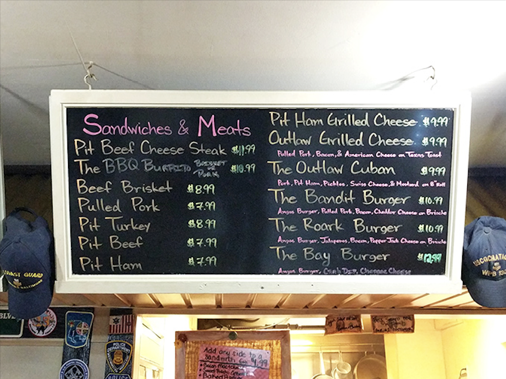The chalkboard menu tells you everything you need to know—life's important decisions boil down to which smoked meat deserves your attention today.