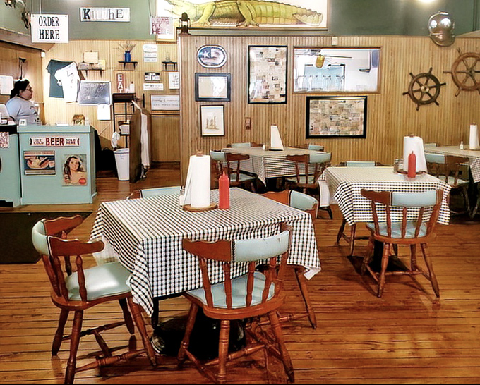 Step inside and time slows down – wooden tables with checkered cloths, nautical decor, and the promise of seafood that doesn't need fancy presentation to impress.