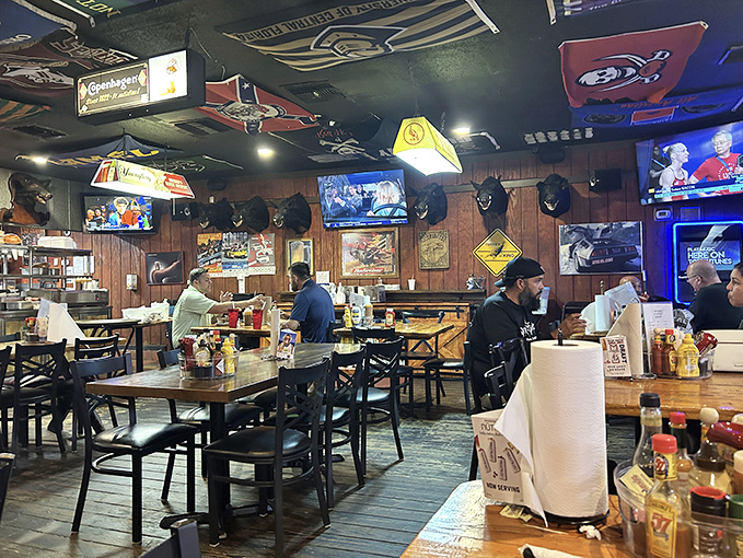 Step inside and the sensory experience shifts into overdrive – rustic wooden walls, mounted trophies, and sports memorabilia create an atmosphere no chain could replicate.