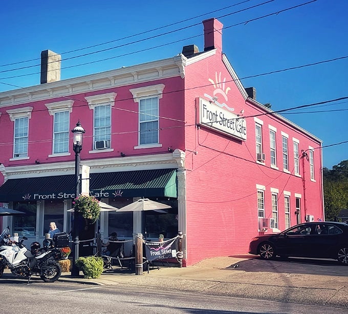 The pink building isn't just eye-catching—it's a beacon for hungry travelers. Front Street Café's historic charm stands out in New Richmond like a culinary landmark.