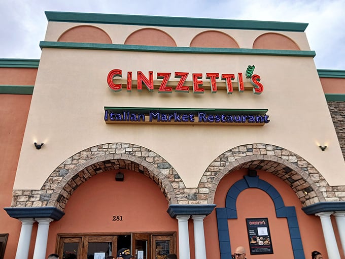 The peach-colored facade with those iconic red letters promises what lies within: a temple dedicated to the religion of Italian carbs.