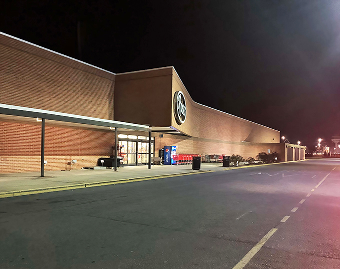 The unassuming exterior of Roses Discount Store transforms into a bargain hunter's paradise once darkness falls. Who knew retail therapy could look so inviting at night?