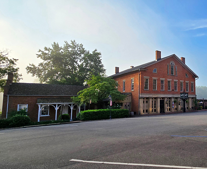 The historic brick façade of The Warehouse Restaurant stands proudly in Coshocton, where a rainbow occasionally appears as if to highlight this culinary treasure.
