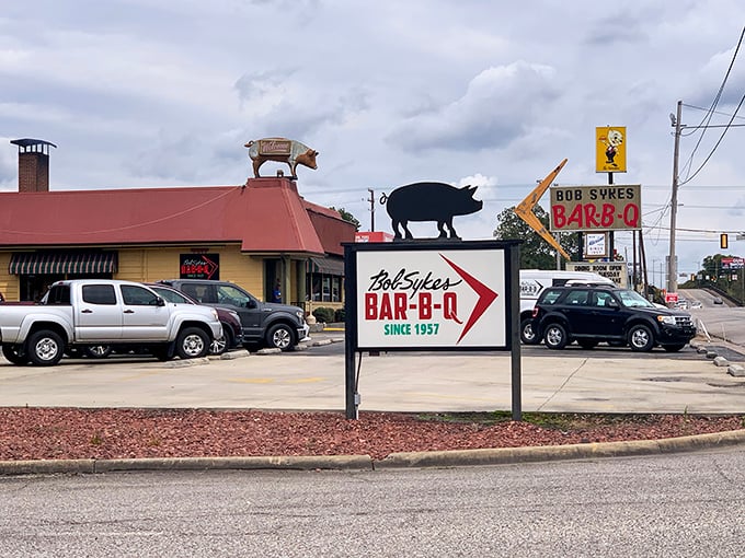 The iconic pig on the roof isn't just decoration—it's a beacon of barbecue brilliance that's been calling hungry Alabamians to Bessemer for over six decades.