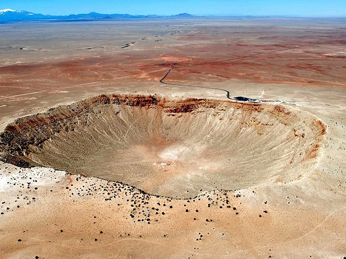 Nature's perfect punch bowl stretches nearly a mile wide, reminding us we're just cosmic dust bunnies in the grand scheme of things.