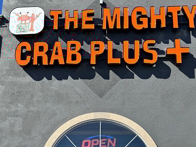 The bold orange signage of The Mighty Crab Plus+ announces itself with the subtlety of a foghorn, promising seafood treasures within this unassuming Benton establishment.