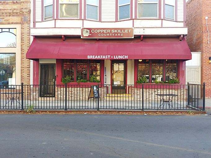 That burgundy awning beckons like a warm hug on Main Street, promising comfort food done right.