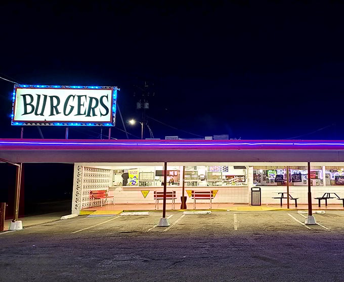 That neon "BURGERS" sign isn't just advertising – it's a beacon of hope for the hungry and a portal to simpler times.