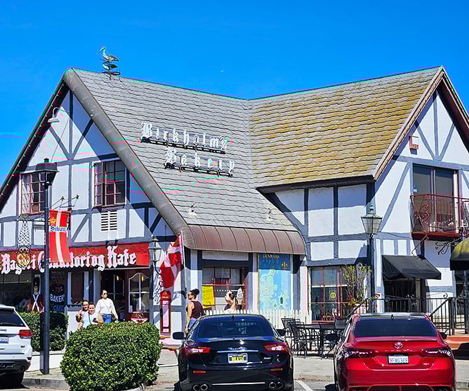 The storybook charm of Birkholm's exterior feels like you've stumbled into a Danish fairy tale, complete with a whimsical bird weathervane keeping watch over pastry paradise.