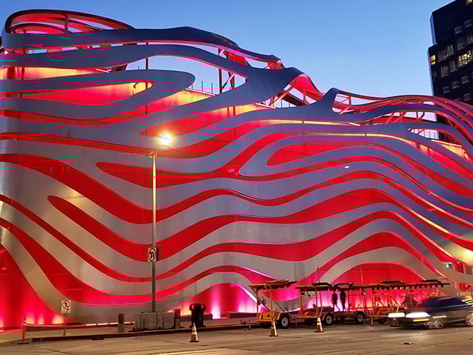 The Petersen's exterior is what happens when a Hot Wheels package meets modern architecture – a rippling metallic masterpiece that's as much art installation as building. Los Angeles showing off again, and we're here for it.