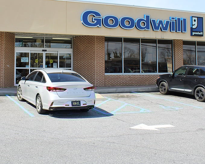 The iconic blue Goodwill sign beckons bargain hunters like a retail lighthouse in the sea of Delaware shopping options.