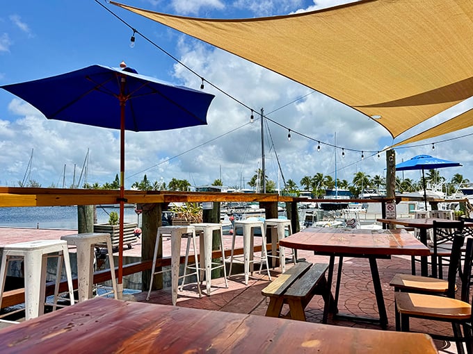 Paradise isn't a place, it's a feeling—specifically the feeling of sipping something cold under those canvas sails while boats bob gently in the background.