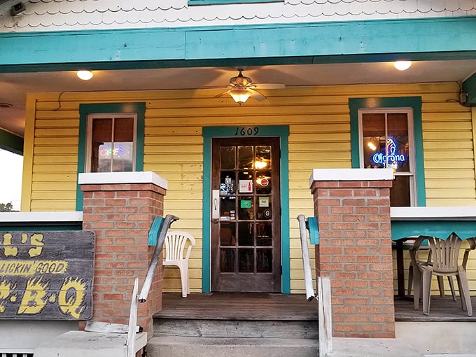 The cheerful yellow exterior with turquoise trim isn't just eye-catching—it's a beacon calling hungry souls to barbecue salvation in Ybor City.