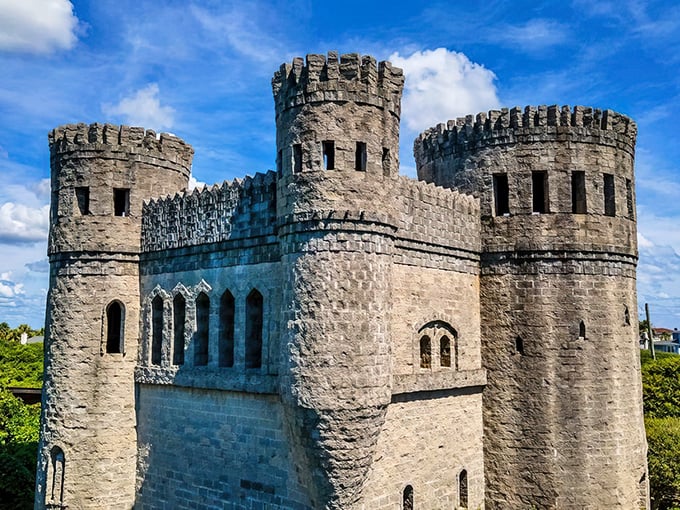 Medieval dreams meet Florida sunshine as Castle Otttis's imposing towers rise against a perfect blue sky, looking delightfully out of place yet somehow right at home.